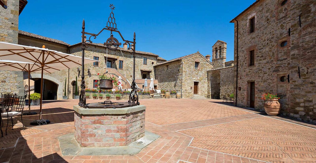 Read about the Story of Castel Monastero Resort in Tuscany